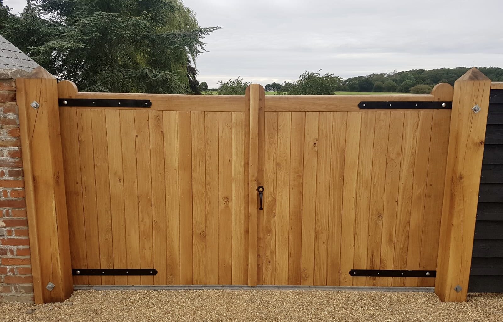 Garage with bespoke timer gates - Roger Gladwell Timber Frame Construction